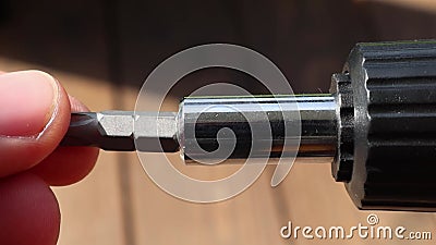 The Screwdriver Head is Slowly Inserted into the Black Screwdriver ...