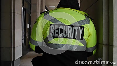 Security Guard Watching and Patrolling Street in City Stock Footage ...