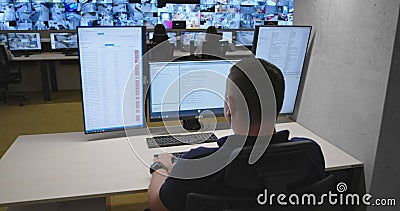 Security Guards Monitoring Modern CCTV Cameras in Surveillance Room ...