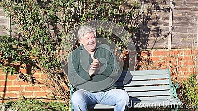 Senior man clapping. stock footage. Video of sitting - 67392088