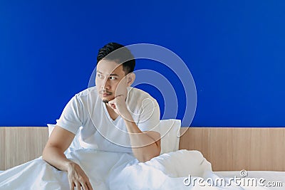 Serious And Grumpy Man Wake Up On The Bed On Blue Space Background ...