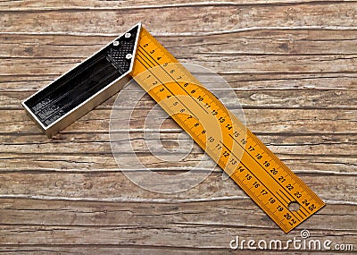 Set-square Isolated On Old Wood Stock Images - Image: 12870864