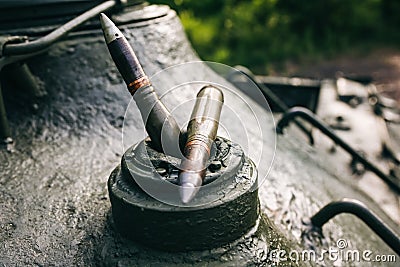 Shell Missile Is Lying On The Old Khaki Peeling Paint Of Armored ...