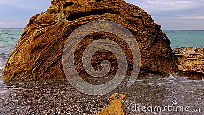 Shell Rock with Curved Layers on a Beach by the Sea, Geological ...