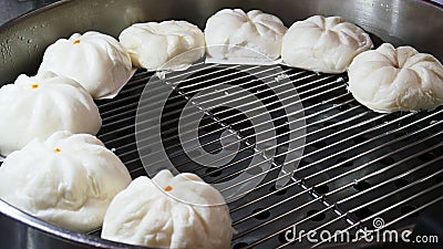 The Shopkeeper Selling the Buns, Using the Tongs, Picking Up the Bun ...