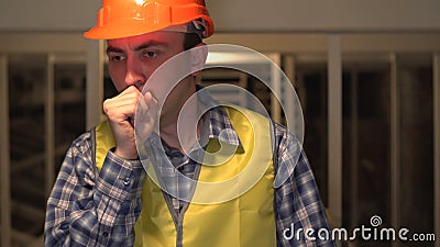 Sick Worker or an Engineer or Architect Coughing on Construction Site ...