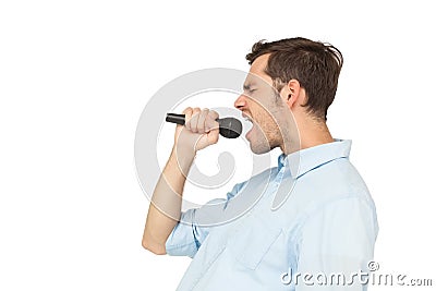 Side View Of A Young Man Singing Into Microphone Stock Photo - Image ...