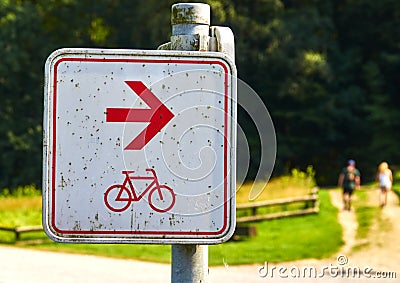 Sign With A Red Arrow For The Direction Of The Cycle Path, Soiled By ...