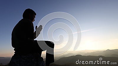 Silhouette of a Man Praying on Top of a Mountain, Prayer of Remembrance ...