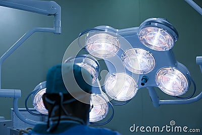 Silhouette Of A Surgeon With Operating Lights In The Background Stock ...
