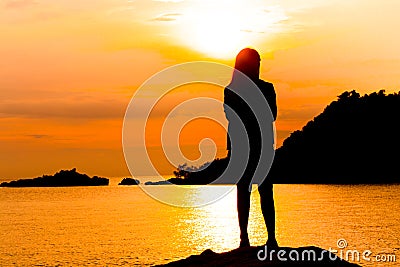 Silhouette Of Young Woman Standing At Relax Pose Or Freedom Pose Or ...