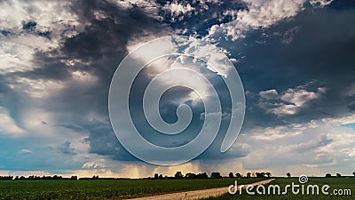 Single Storm Cell Cloud with Sun Rays Forming Over the Fields Stock ...