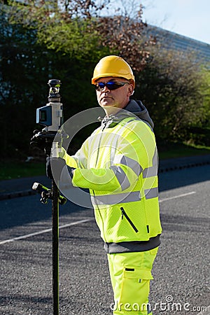 Site Engineer Checking Levels Of Road Using Autolevel Stock Photo ...