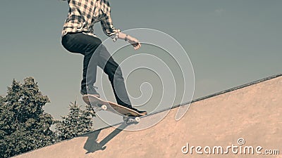 A Skateboarder Defies Gravity As he Rides His Skateboard in an Empty ...