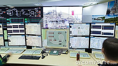 People at Monitors Check Process at Gas Refinery Plant Stock Footage ...