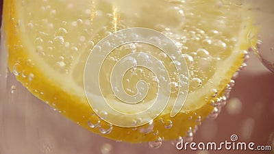 A Slice of Lemon in a Glass with a Carbonated Drink Stock Footage ...