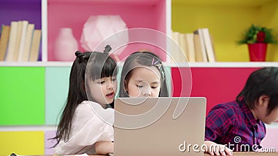 Slow Motion - Group of Children Using Laptop in Classroom, Multi-ethnic Young Boys and Girls ...