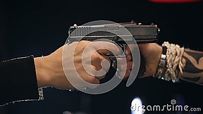 SLOW MOTION: Two Male Hands with Guns Take Aim at Each Other Stock ...