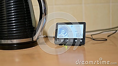 Slow Pull Out from a Smart Meter Next To a Kettle Stock Footage - Video ...