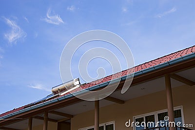 Solar Panel For Hot Water System On Roof Blue Sky Background. Royalty ...