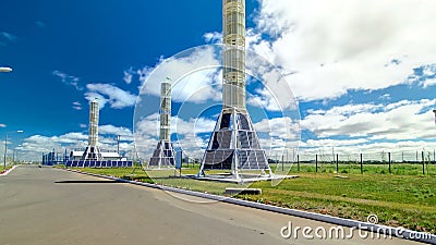 Solar Panel Towers on Solar Plant with High Voltage Tower in Background ...