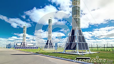 Solar Panel Towers on Solar Plant with High Voltage Tower in Background ...