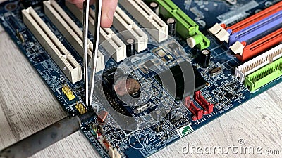 Soldering Motherboard. Engineer Solder a Chipset Under a Magnifying ...