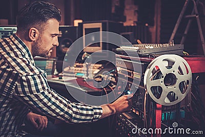 Sound Engineer Working With Professional Audio Equipment In The ...