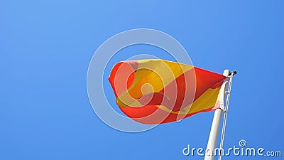 Spanish Flag Flying in the Blue Sky Background Stock Footage - Video of ...