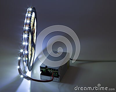 Spool Of Luminous LED Strip Light Connected To Power Supply. Royalty ...