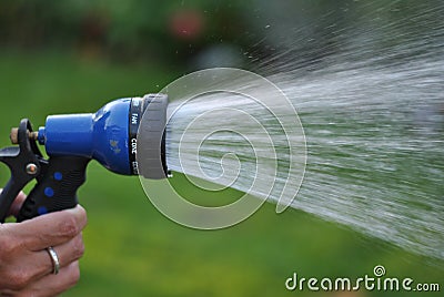 Spraying Garden Hose Royalty Free Stock Photo - Image: 28717015
