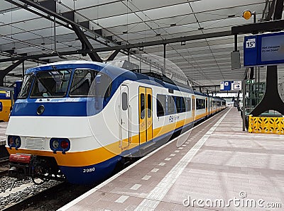 Sprinter Train Between Rotterdam And Gouda Is Waiting Along Platform At ...