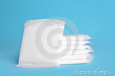 Stack Of Menstrual Pads On Light Blue Background Royalty-Free Stock ...