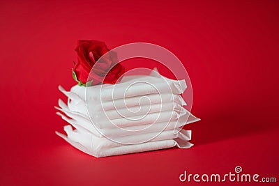 Stack Of Menstrual Pads With Red Rose On Color Background Royalty-Free ...