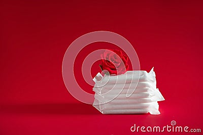 Stack Of Menstrual Pads With Red Rose On Color Background Royalty-Free ...