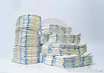 Stacks Of Diapers Stacked In Staggered Rows On A White Background ...
