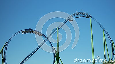 A Roller Coaster Ride Passing through a Dead Loop Turning Passengers ...