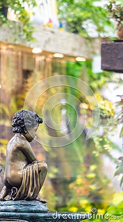 Statue Of Angel And Waterfall In Cozy Garden. Royalty-Free Stock Photo ...