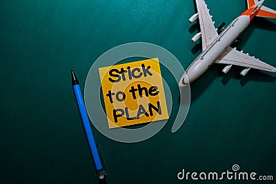 Stick To The Plan Write On A Sticky Note Isolated On Office Desk ...
