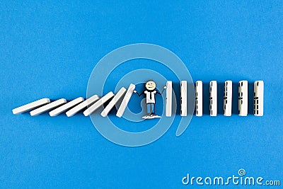 Stickman Figure Preventing Line Of Domino Tiles From Falling Royalty ...