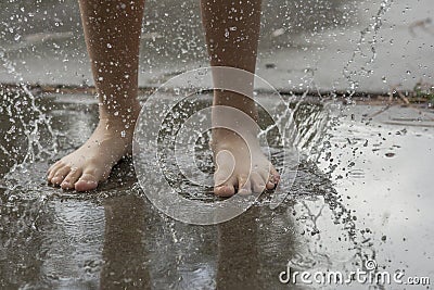 Stomping In The Puddle. Stock Photo - Image: 42960675