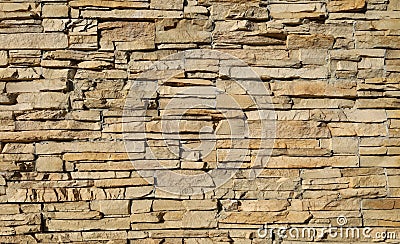 Stone Cladding Wall Made Of Striped Stacked Slabs Of Natural Brown ...