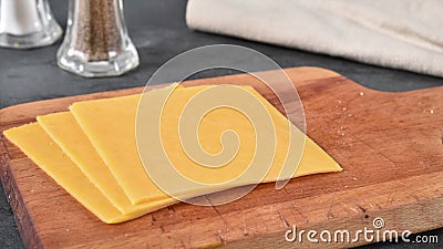 Stacking Sides of Cheddar Cheese on a Cutting Board Stock Video - Video ...