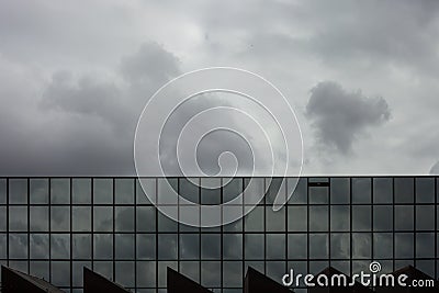 Storm Clouds Reflect In Windows Of Office Building/ Mirror Windows With ...