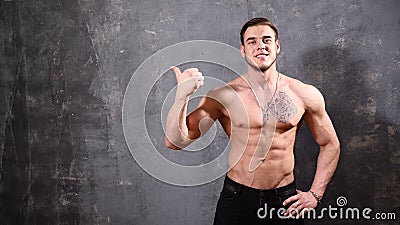 Strong and Muscular Man Bodybuilder. Man Posing on a Black Background ...