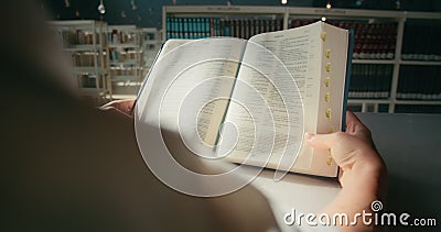 Student Self-taught Reading a Book in University Library. Female Hands ...