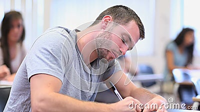 Student taking notes stock footage. Video of male, class - 42769378