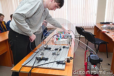 Students Connect Wires Control Panel With Small Test Bench For ...