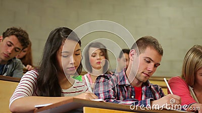 Students Listening Carefully in Lecture Hall and Taking Notes Stock ...