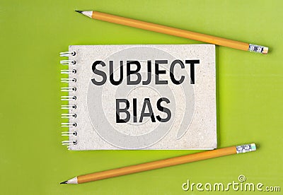 SUBJECT BIAS - Words In Notepad On Pistachio Background And Crayons ...